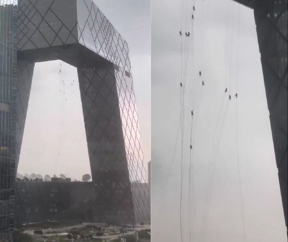 China: Glass Maintenance Workers Trapped Hanging From Building in ...
