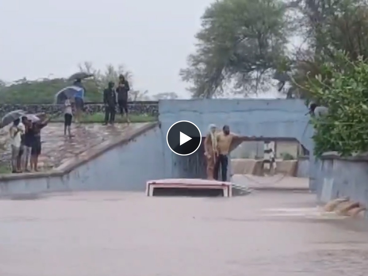 Gujarat Rains: Locals Rescue Couple Trapped on Roof of Submerged Bus in ...